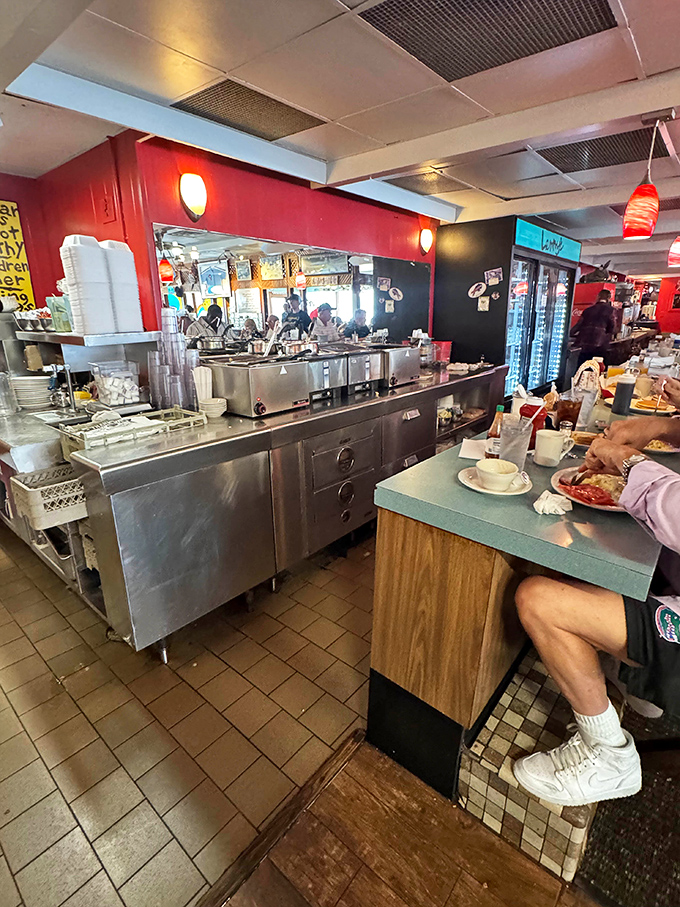 The bustling kitchen counter &ndash; where breakfast magic happens at lightning speed and servers perform their coffee-pouring ballet.