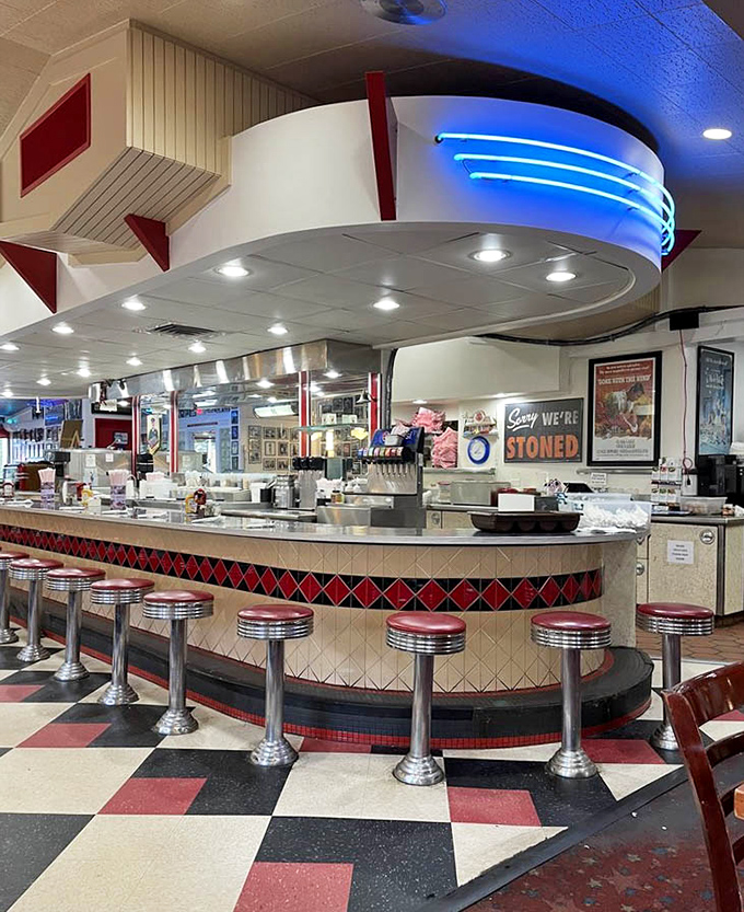 The curved counter with its diamond pattern tile work is a mid-century masterpiece. Those chrome stools have heard every story Flagstaff has to tell.