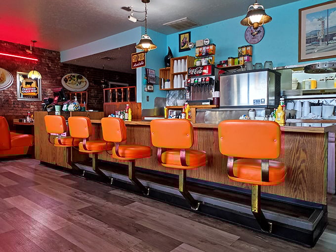 The counter seats offer front-row tickets to the breakfast show—where coffee refills are frequent and the short-order choreography never disappoints.