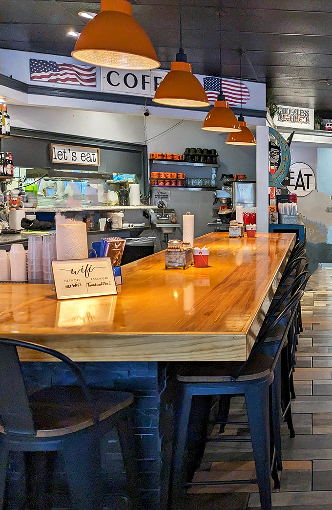 The counter where breakfast dreams come true. That "Let's Eat" sign isn't a suggestion&mdash;it's the best advice you'll get all day.