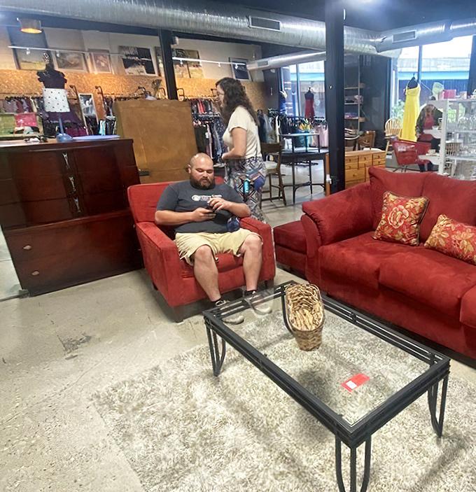 Nothing says "I've figured out life" quite like relaxing on a red sofa you just scored in your twenty-five-dollar cart.