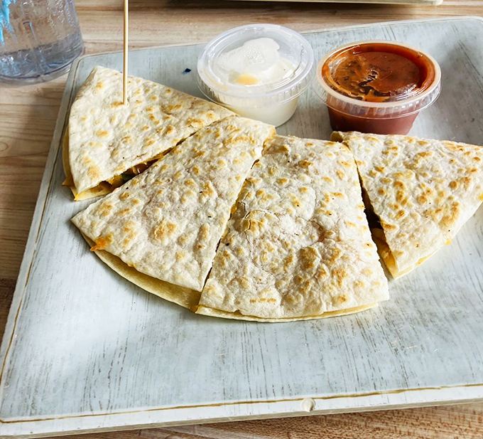 A quesadilla that proves cheese and tortillas are just the beginning of a beautiful relationship when seafood joins the party.