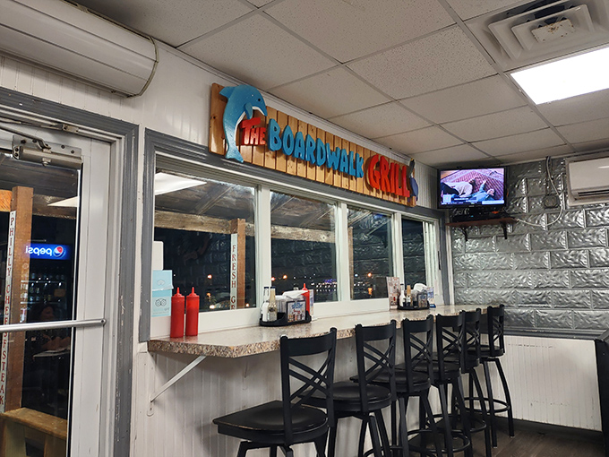 The interior signage featuring a dolphin logo reminds you that yes, you're dining where the water meets the land&mdash;and both are pretty happy about it.