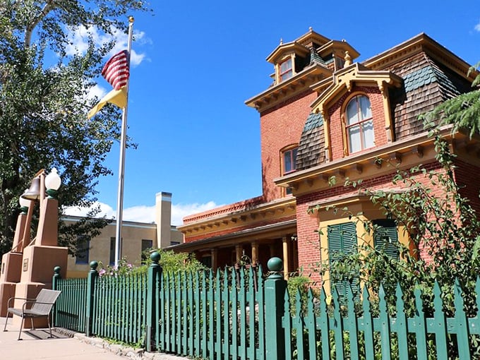 Behind that mint-green picket fence lies a Victorian treasure trove of Silver City history, served with a side of architectural delight.
