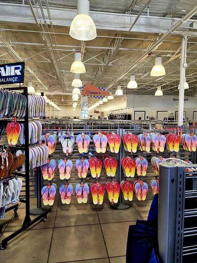 A rainbow of flip-flops hangs like tropical fruit, ready to transport your feet to vacation mode for less than a beach cocktail.