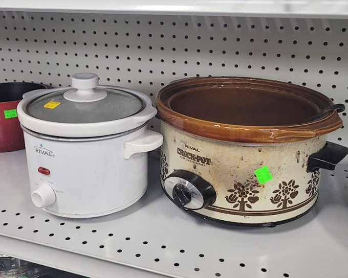 Rival slow cookers standing at attention – one pristine, one battle-scarred – both ready to simmer your Sunday stew for pocket change.