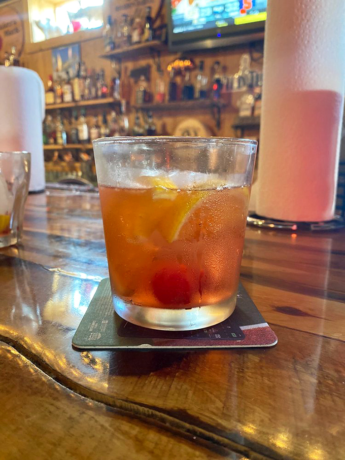 This isn't just a cocktail; it's a bourbon ambassador in a glass, complete with fruit diplomats negotiating the perfect sip.