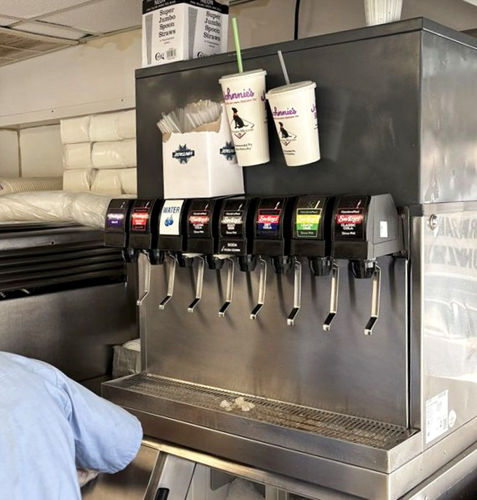 The soda fountain station stands ready for duty, like a hydration command center for beef-induced thirst emergencies.