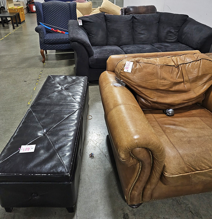 Sofa city where leather, microfiber, and vintage upholstery compete for your living room real estate at prices that seem like typos.