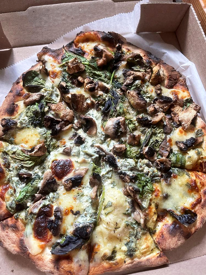This mushroom and spinach pizza isn't just vegetarian&mdash;it's a fungi festival where earthy mushrooms and vibrant greens throw the party of the year.