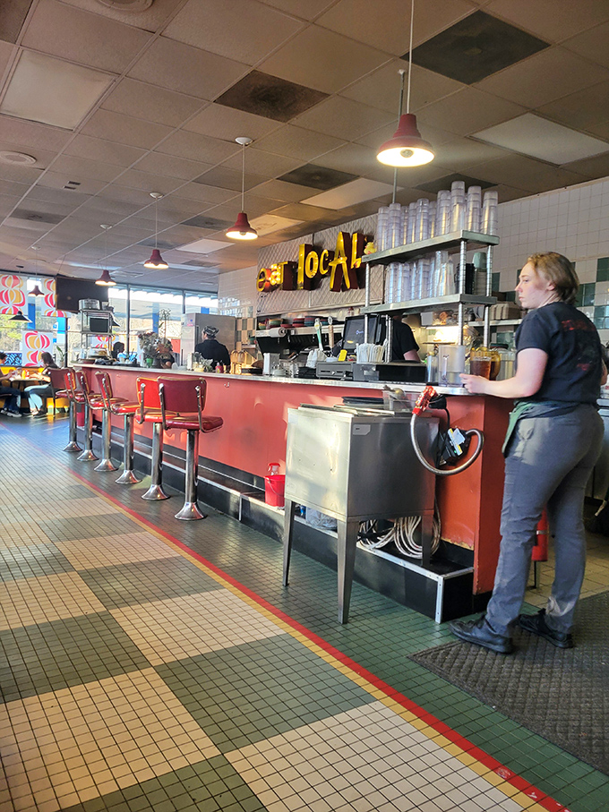 Behind the counter, culinary magic happens with efficiency that would impress even the most seasoned short-order cook.