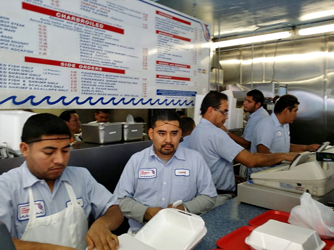 The kitchen crew works with the synchronized precision of a submarine team, turning out plate after plate of seafood that keeps the locals coming back.