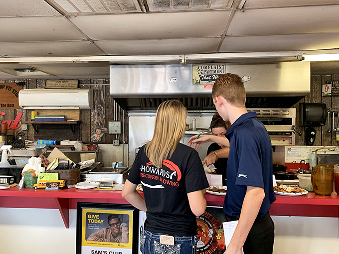 The magic happens behind the counter, where BBQ artisans transform humble cuts into neighborhood legends through smoke, time, and know-how.