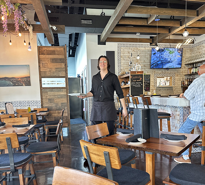 The dining room's rustic-modern vibe strikes that perfect balance between "special occasion" and "I could eat here every Tuesday."