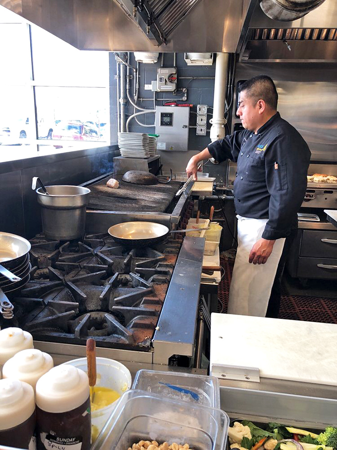 In the kitchen, focused hands transform the ocean's bounty into plates that make diners involuntarily close their eyes in appreciation.