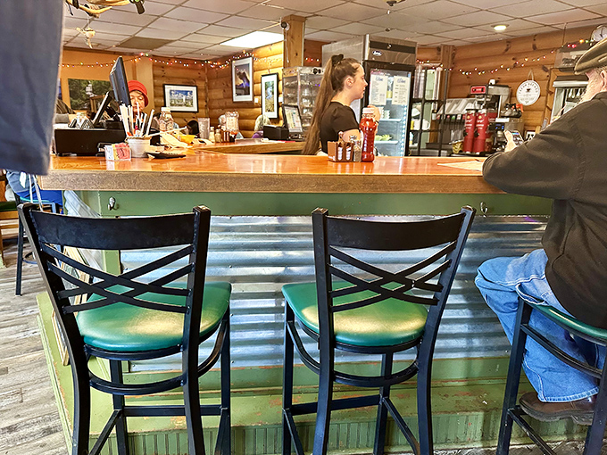The mint-green counter adds a pop of color to the rustic interior, inviting you to "Please seat yourself" &ndash; the first step in any great breakfast adventure.
