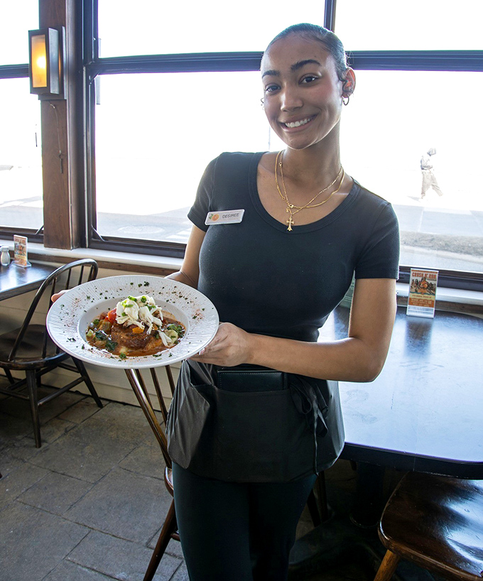 Great food deserves great service&mdash;a beautifully plated dish making its journey from kitchen to lucky table.