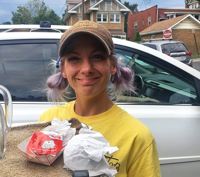 The staff cap says it all—you're not just getting food; you're getting a piece of West Virginia culinary heritage served with a smile.