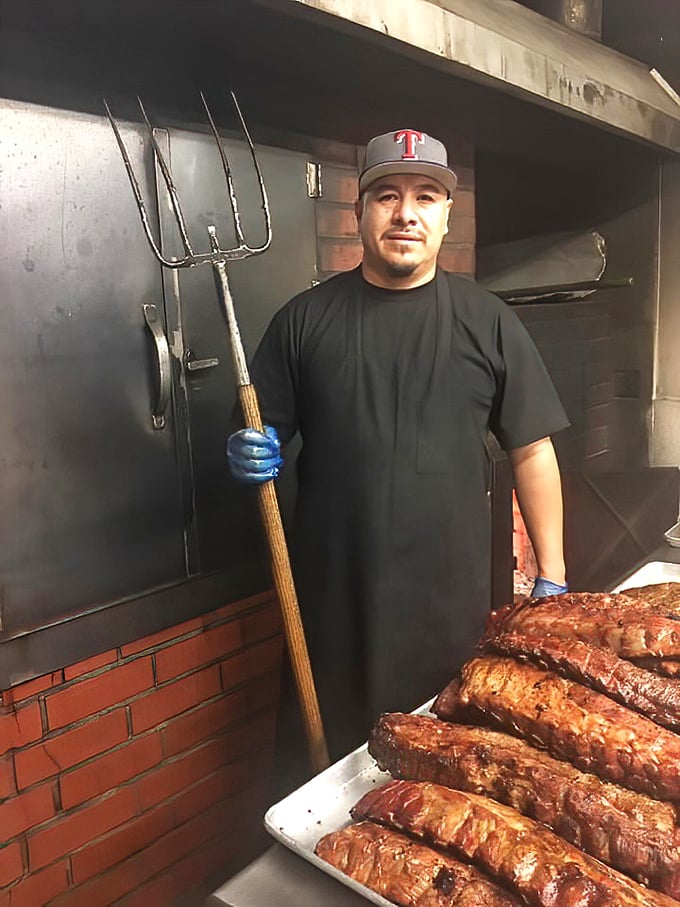 The pitmaster's trident says it all&mdash;this is serious BBQ business. Those meats have met their match in skilled hands.