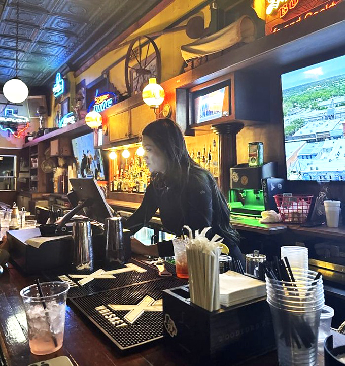 The bar area: where drinks are poured, stories are shared, and the neon signs have seen it all but aren't telling.