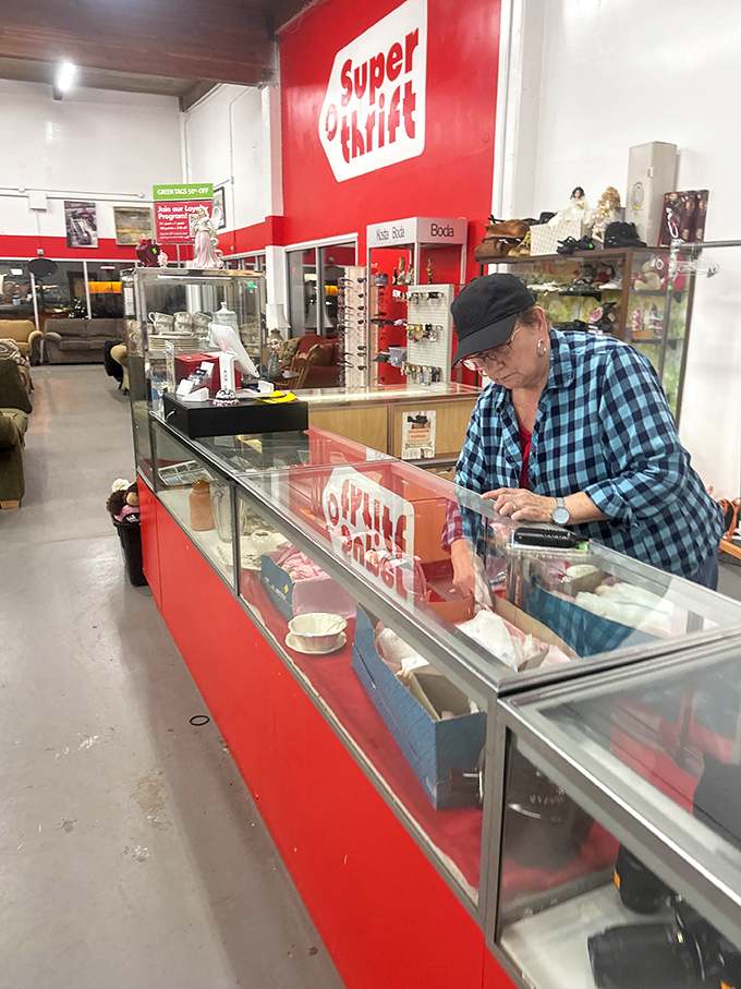 Behind every great thrift store is a dedicated team member carefully curating treasures in display cases for eager bargain hunters.