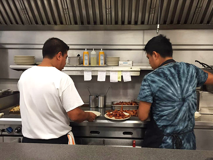 Behind the scenes where breakfast dreams come true &ndash; the open kitchen concept lets you witness the egg-cracking, pancake-flipping symphony in real time.