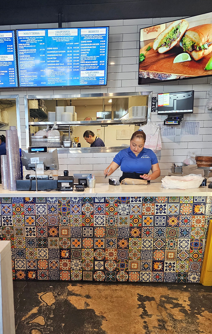 Behind the counter magic happens, with colorful Mexican tiles adding a splash of authenticity to the modern space.