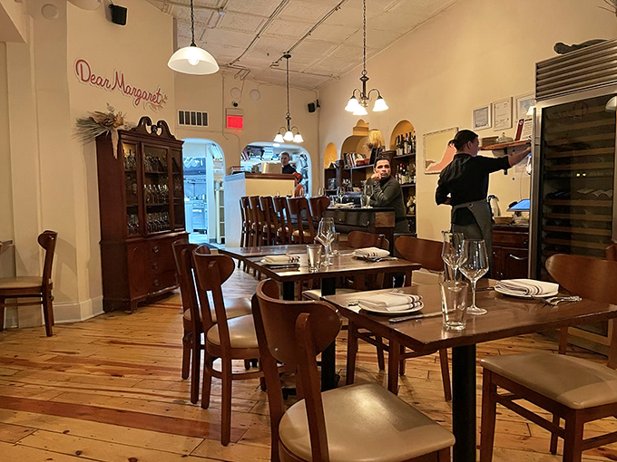 The open kitchen and visible staff remind you that real people are crafting each dish with care, skill, and genuine passion.