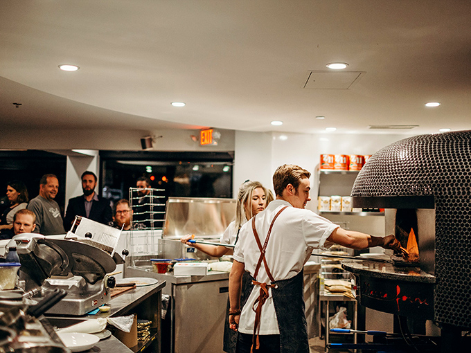 Where the magic happens—watching skilled hands coax dough into the fiery dome is dinner and a show rolled into one.