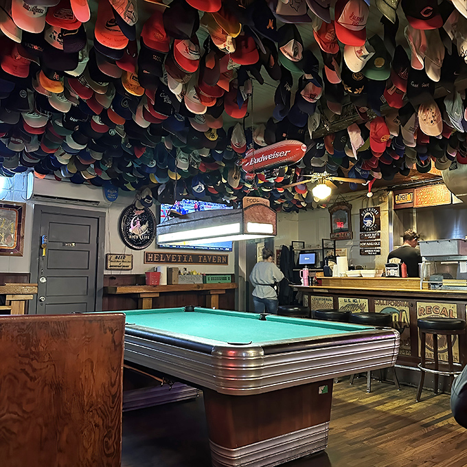 Where the magic happens&mdash;a pool table under a ceiling of caps. The ultimate test: can you sink the eight ball without getting distracted by the headwear?