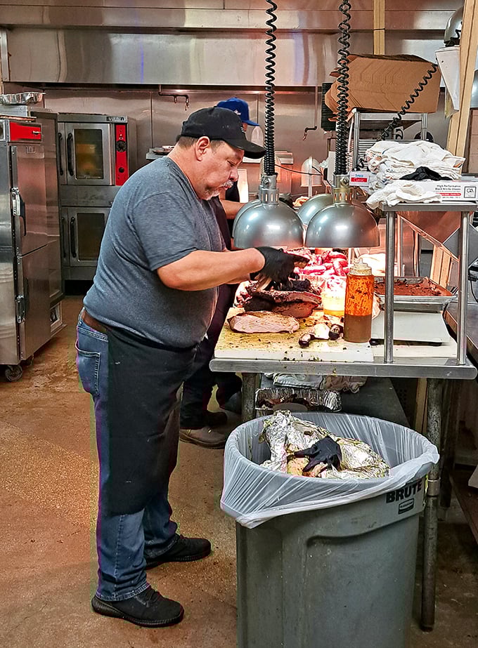 Behind the scenes, where BBQ magic happens. Each slice of brisket is handled with the care usually reserved for newborn babies or rare diamonds.