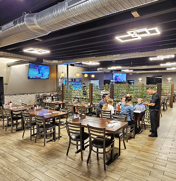 A dining room where conversations flow as freely as the tea, with TVs strategically placed for those awkward first-date lulls.