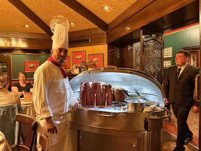 The silver meat cart approaches &ndash; dinner theater at its finest. This moment of tableside carving is worth the price of admission alone.