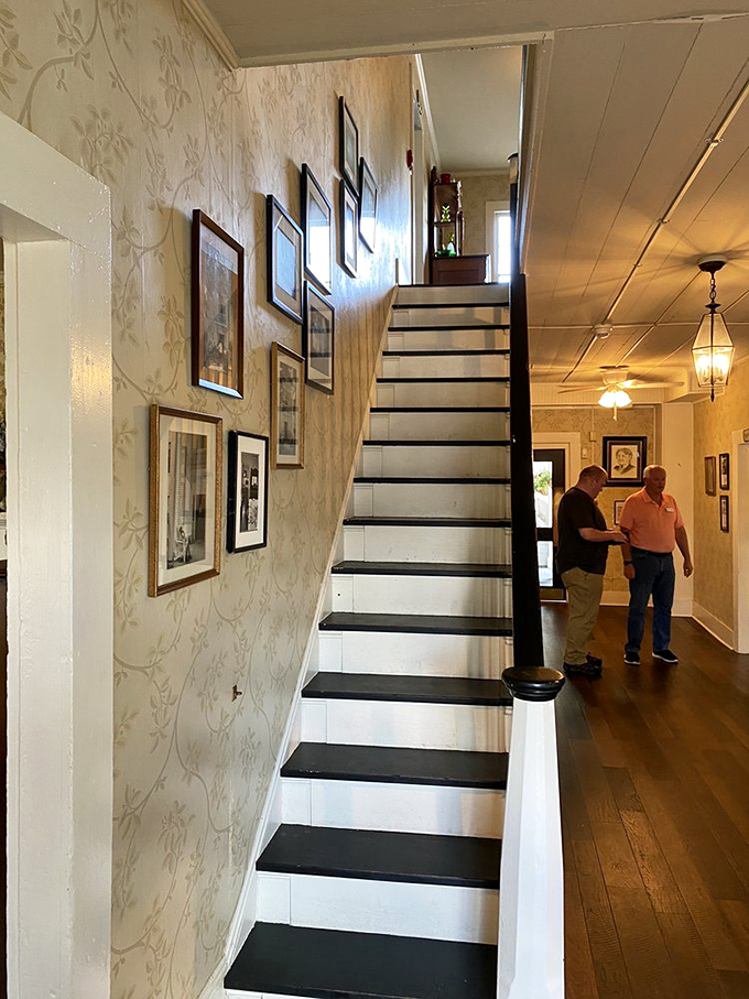 The staircase tells stories with every creaky step, while the gallery of framed memories on the wall keeps count of happy diners.