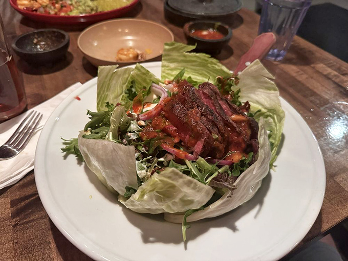Perfectly seared steak crowning a mountain of fresh greens&mdash;proof that salads can absolutely be worth the calories.