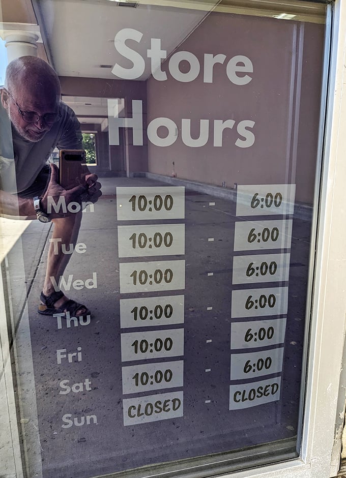 Store hours posted clearly&mdash;because knowing when to hunt for treasures is half the battle in the thrifting game.