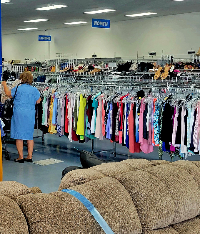 Bright colors organized by shade create a rainbow effect that makes browsing feel like walking through a textile kaleidoscope.