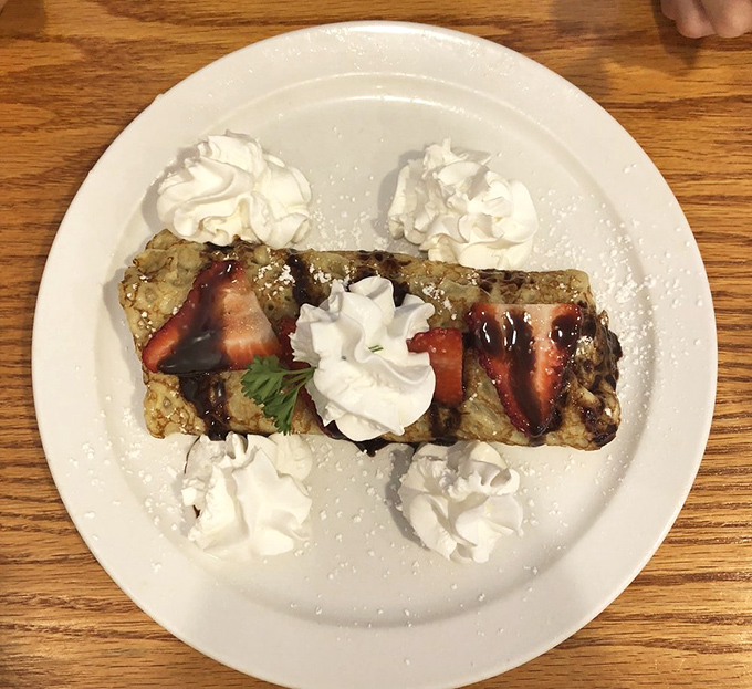 Strawberry plantain crepe drizzled with chocolate and crowned with whipped cream&mdash;breakfast just got fancy without being pretentious about it.
