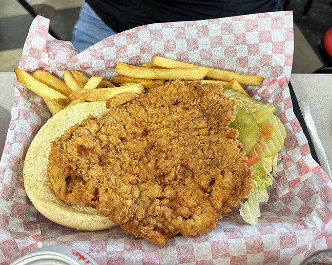 The tenderloin sandwich and fries represent Indiana comfort food at its finest&mdash;golden, crispy, and substantial enough to fuel a factory shift.