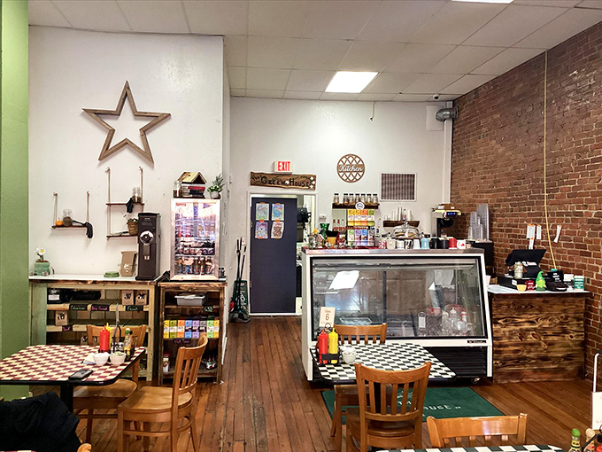Exposed brick walls and checkerboard tables create the perfect backdrop for coffee conversations that somehow always taste better in small-town caf&eacute;s.