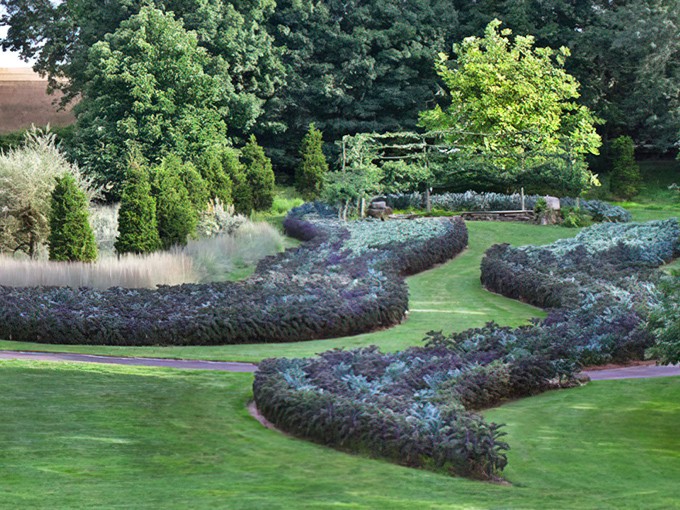 The Serpentine curves through the landscape like a river made entirely of flowers and good intentions.