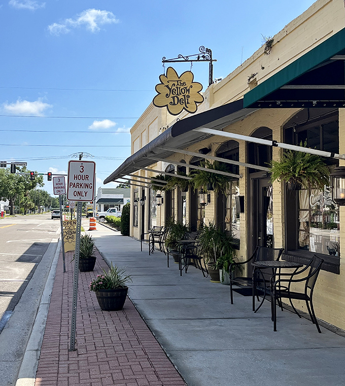 The Yellow Deli's inviting sidewalk seating beckons you to slow down, sip something cool, and remember what conversation was like before smartphones.