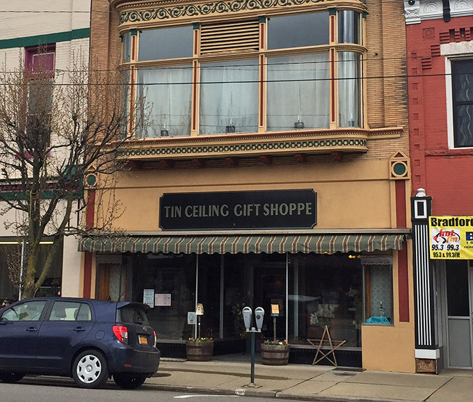 The Tin Ceiling Gift Shoppe invites curious browsers with its vintage storefront – the kind of place where you'll find treasures Amazon's algorithm would never suggest.