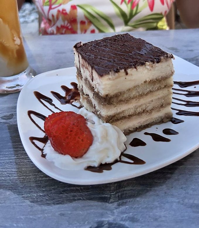 Tiramisu that's dressed better than most wedding guests&mdash;layers of coffee-soaked elegance topped with chocolate and a strawberry beret.