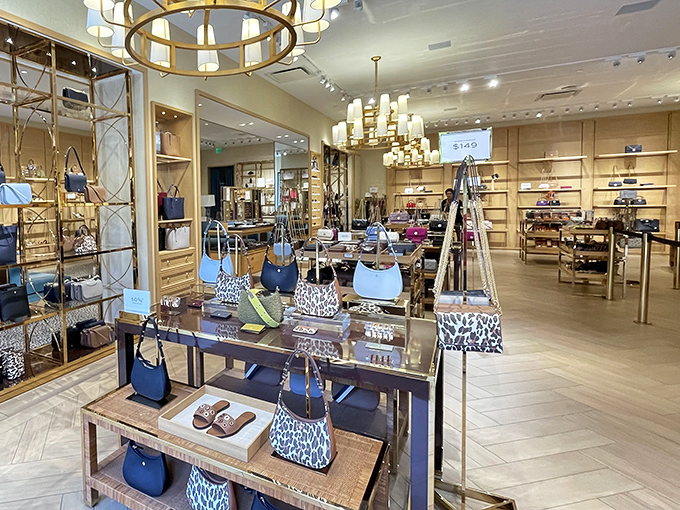 Tory Burch's elegant interior showcases handbags that whisper "luxury" while price tags tactfully shout "but actually affordable luxury!" 
