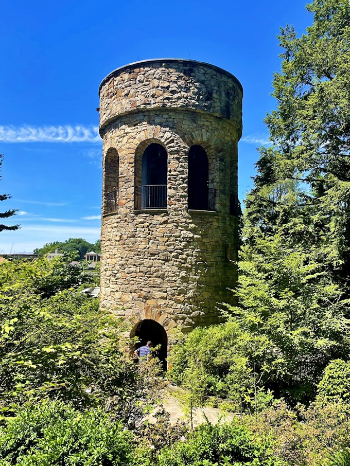 Medieval meets botanical in this stone tower lookout. Standing tall among the greenery like a chess piece that wandered into paradise.