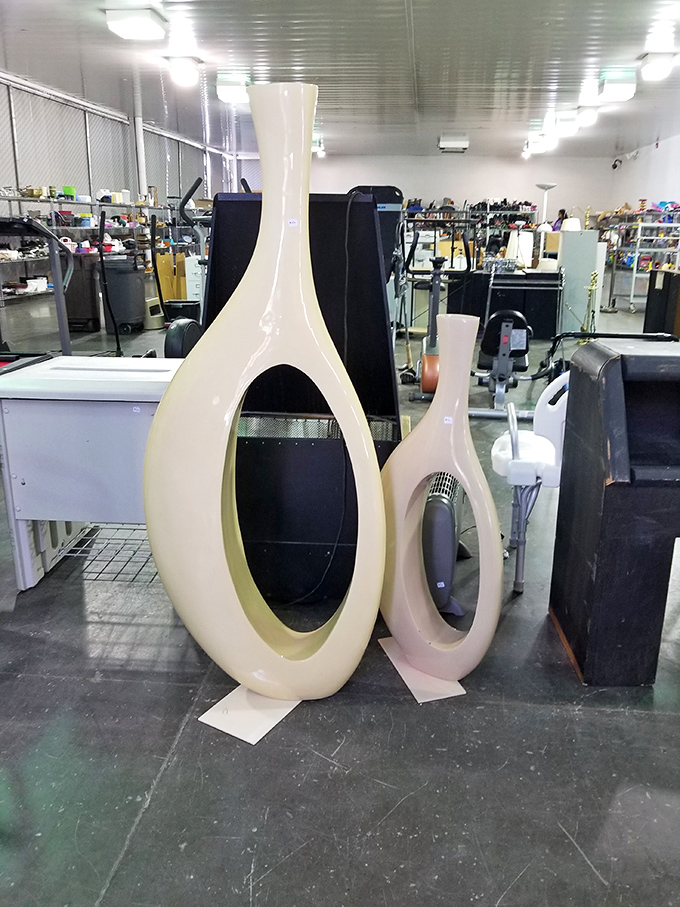 Modernist vases that would cost a fortune in a downtown boutique wait patiently for someone who appreciates their retro curves.