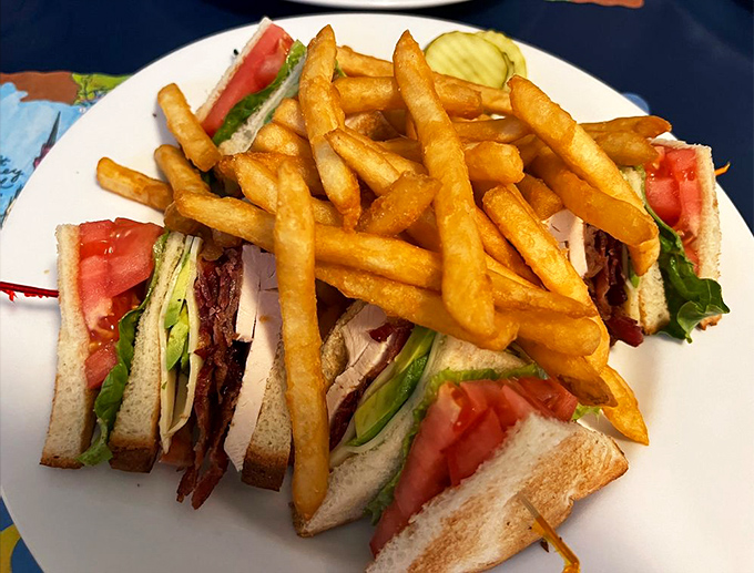 The club sandwich &ndash; that three-story architectural marvel that makes you wonder if sandwiches need building permits and structural engineers.