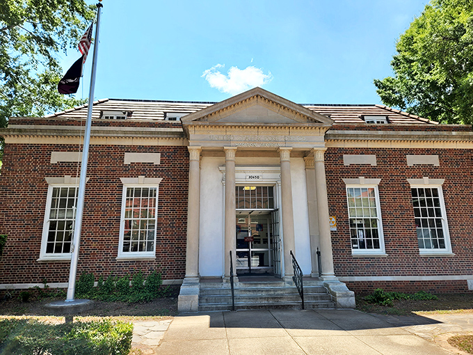 The post office building radiates that classic federal architecture energy that makes mailing packages feel almost patriotic.