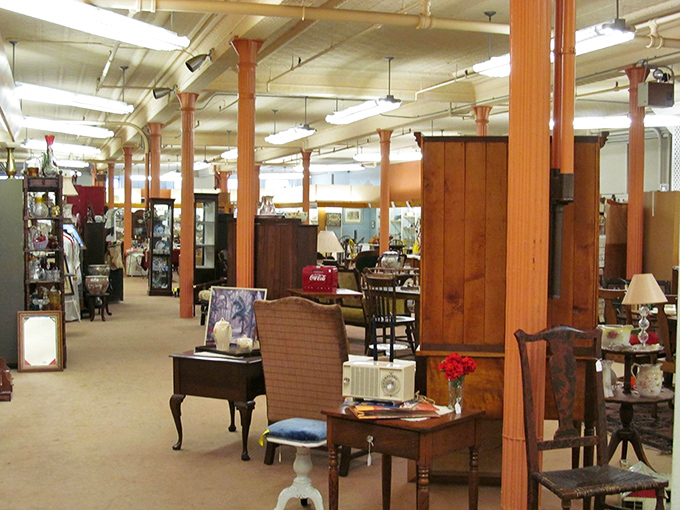 Wooden columns frame a treasure trove where yesterday's household items become tomorrow's conversation pieces. Decorators call this "vintage" – we call it perfect.